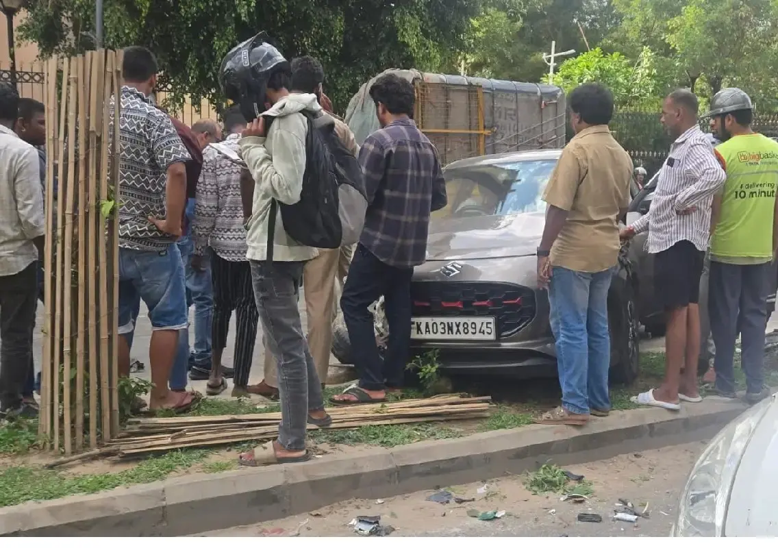 Woman escapes unhurt after car crashes into divider during U-turn ...