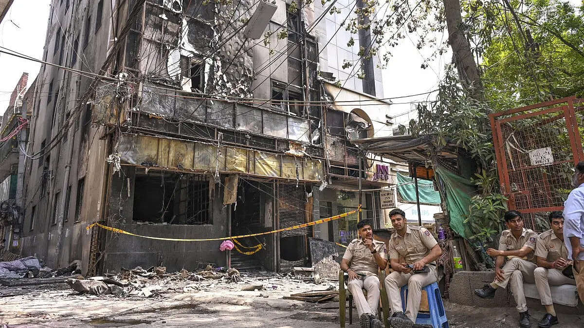 A sticky note, a loss and a long wait: Delhi fire victim's family ...