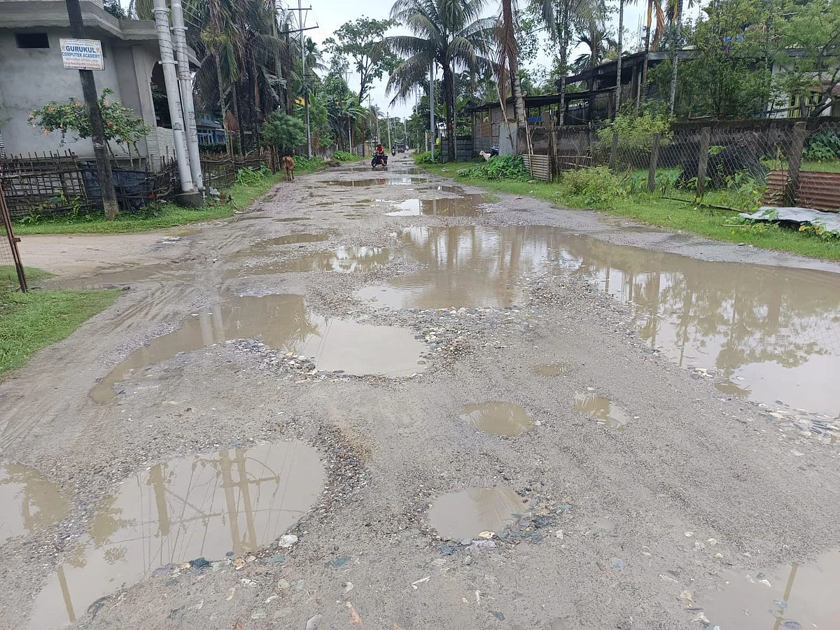 Nalbari: Rainwater-filled potholes leave Ghograpar-Tamulpur Road nearly ...